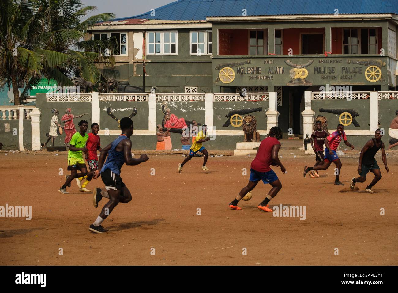 Accra, Ghana. Young Ghanaian Men Playing Soccer in front of Mantse ...