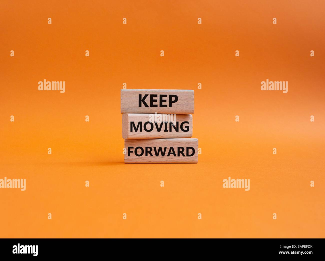 Keep moving forward symbol. Concept words keep moving forward on wooden blocks. Beautiful orange ...