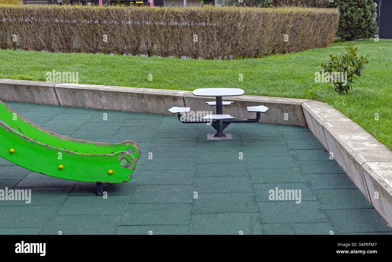 Green Slide Table With Chairs Set at Playground in City Park Stock ...