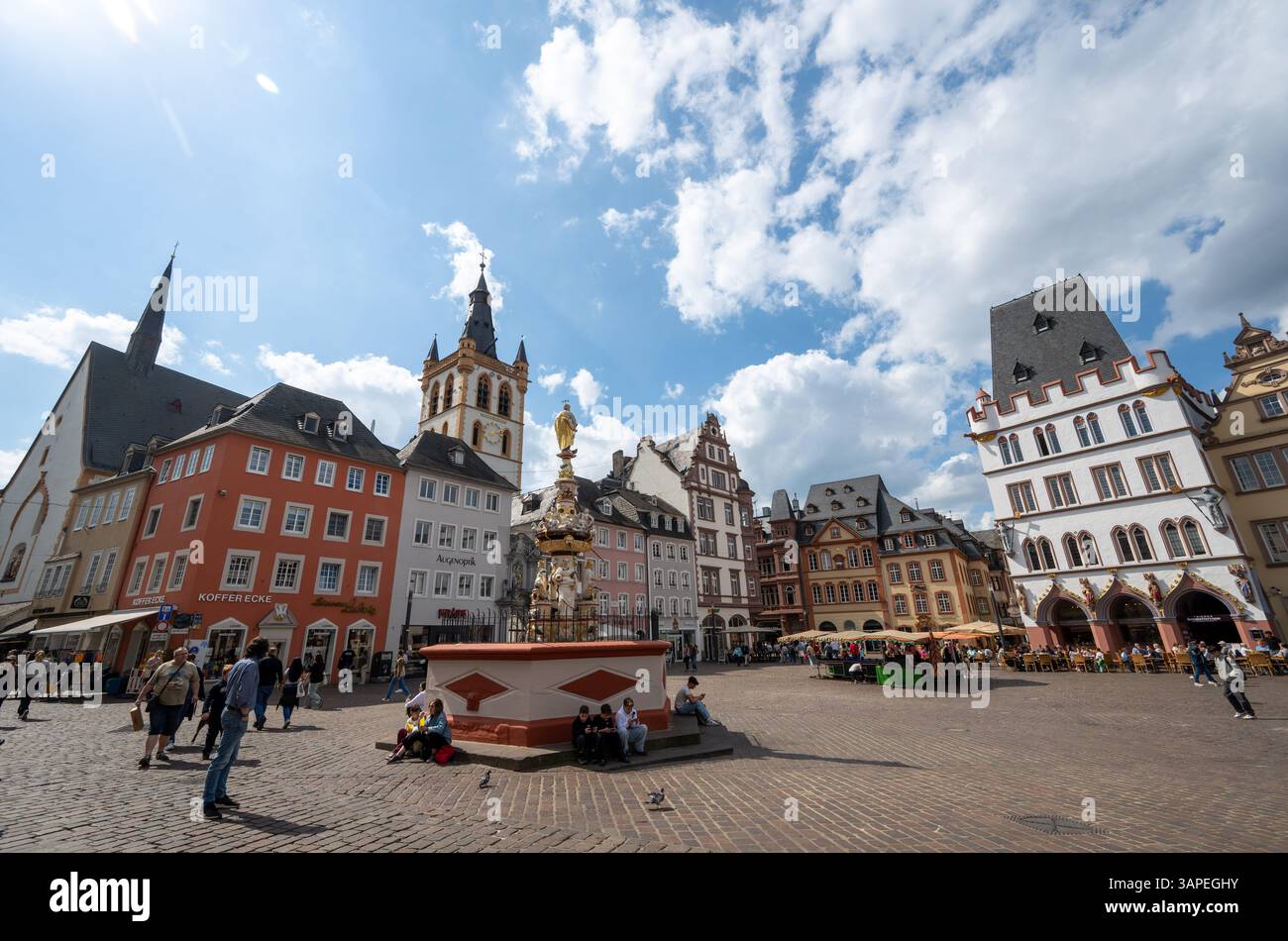 Trier, Germany. 14th Apr, 2025. People walk through Trier's main market ...