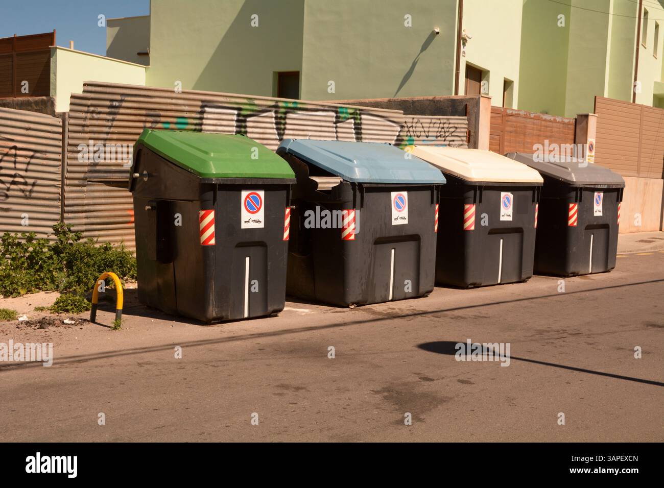 Four recycling bins on the roadside in S'Arenal ,Mallorca, Spain. Green ...