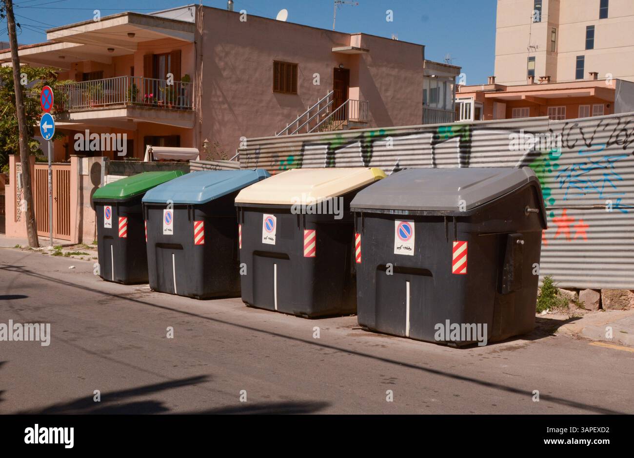 Four recycling bins on the roadside in S'Arenal ,Mallorca, Spain. Green ...