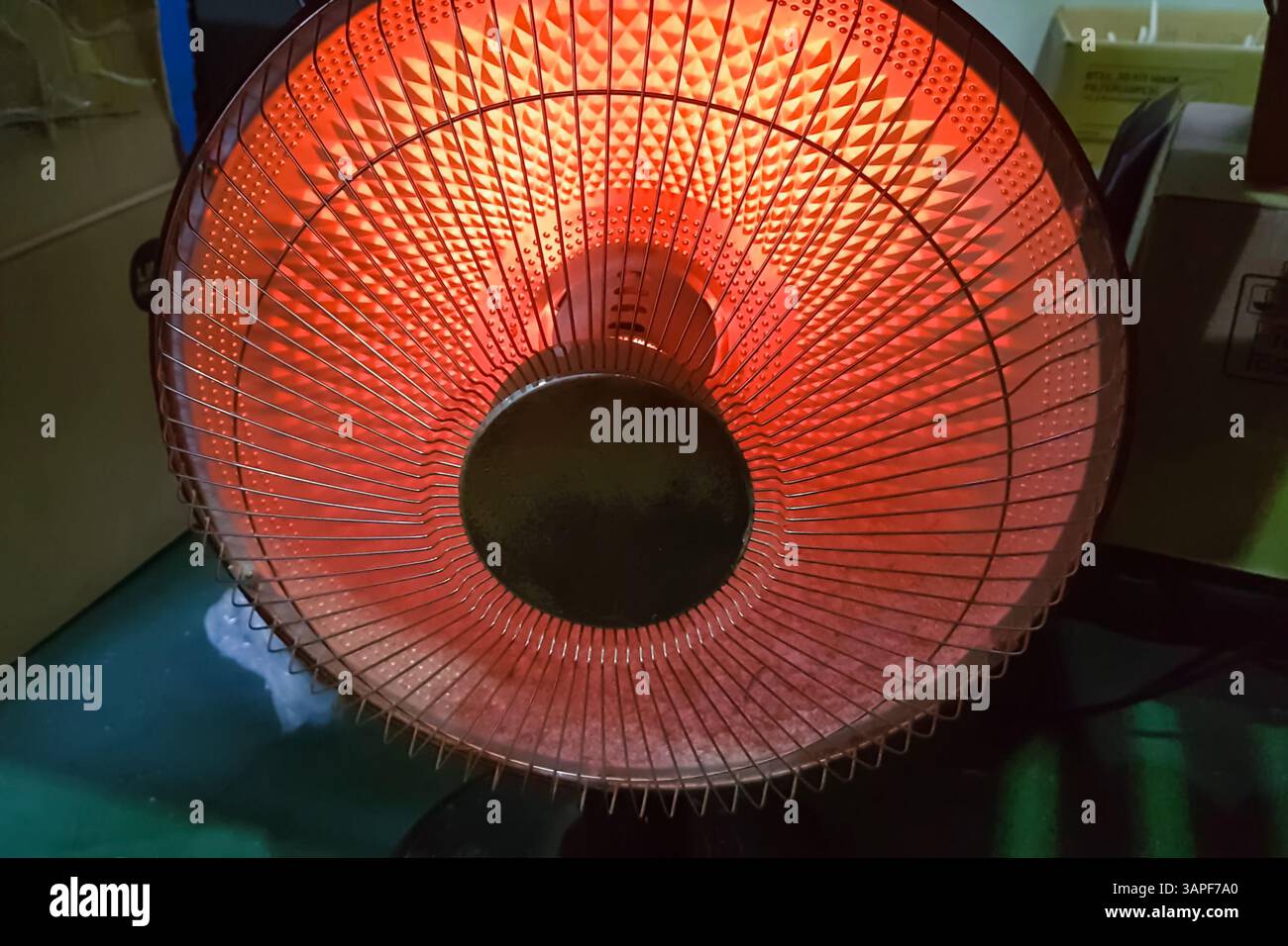 Infrared heater with cooler. The red glow of the heater Stock Photo - Alamy