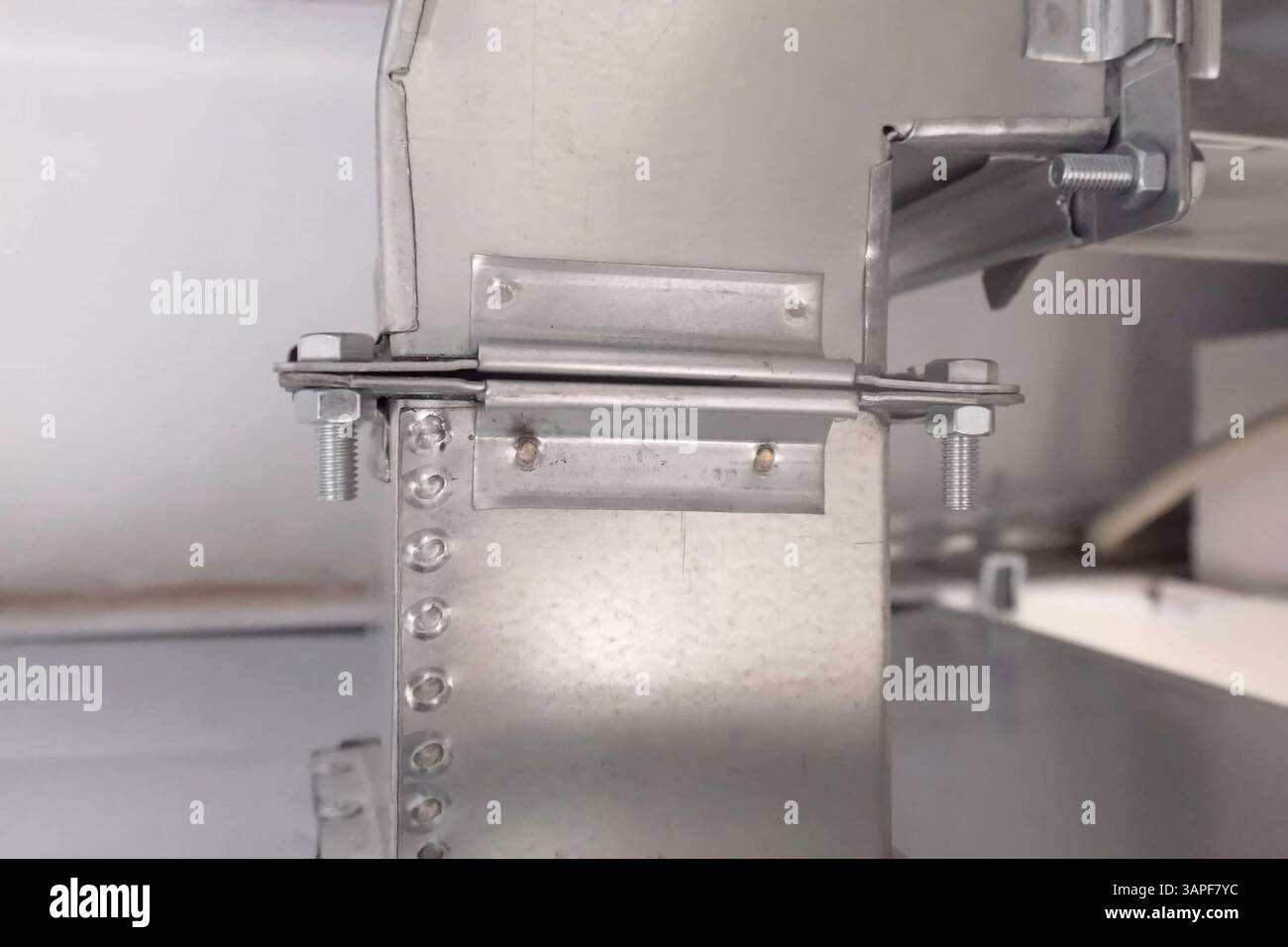 Connection of ventilation with bolts and nuts. Connection of ...