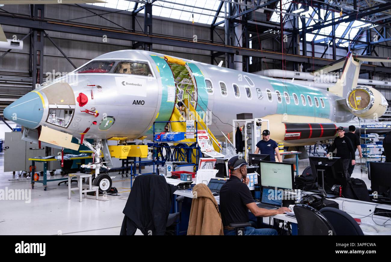 Montreal, Canada. 14th Apr, 2025. Bombardier employees work on an ...