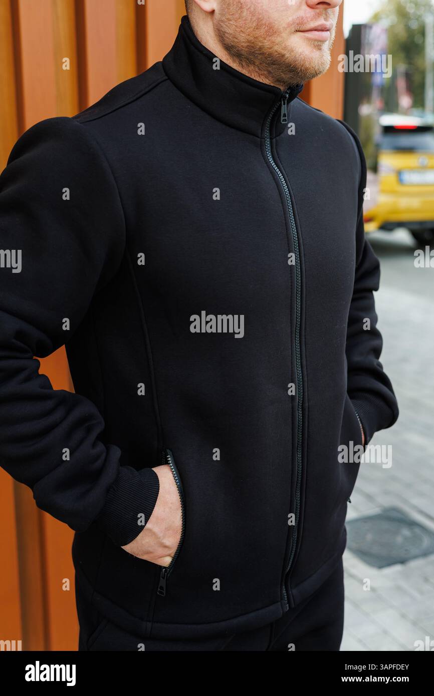 A contemporary black jacket showcases a sleek and stylish design ...