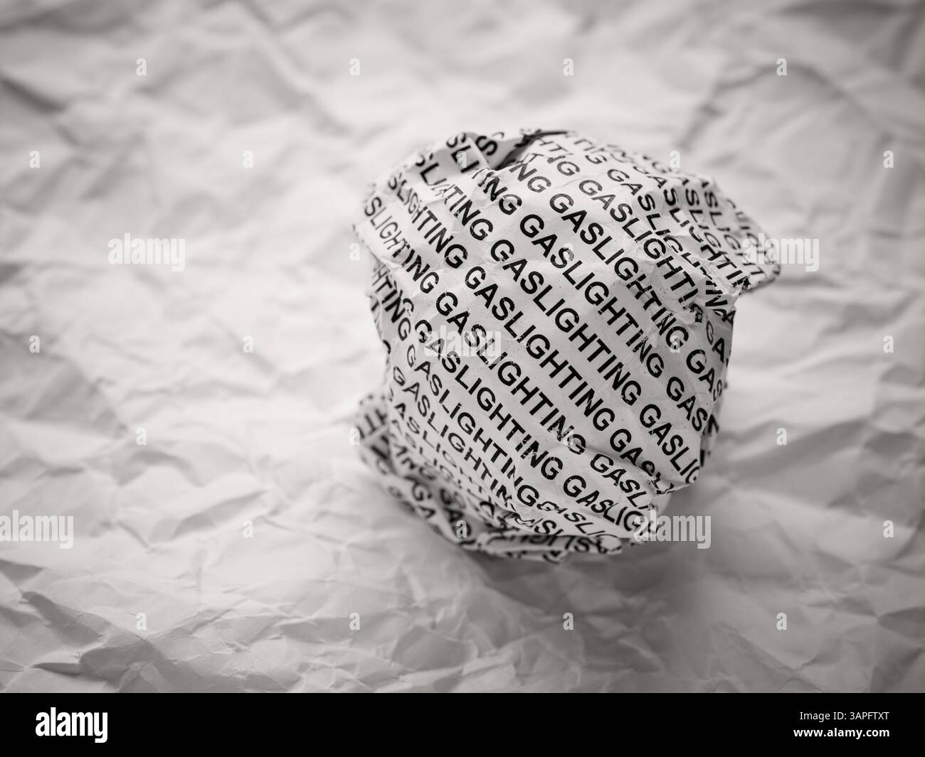 Crumpled paper ball with words Gaslighting on crumpled white paper ...
