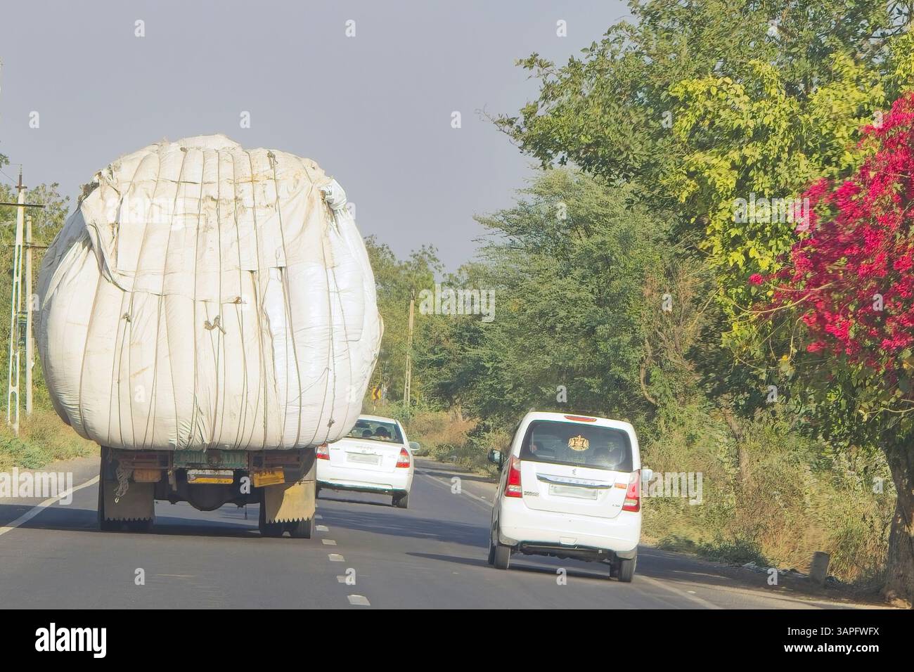 An overloaded lorry, typical of many seen on the roads of India Stock ...