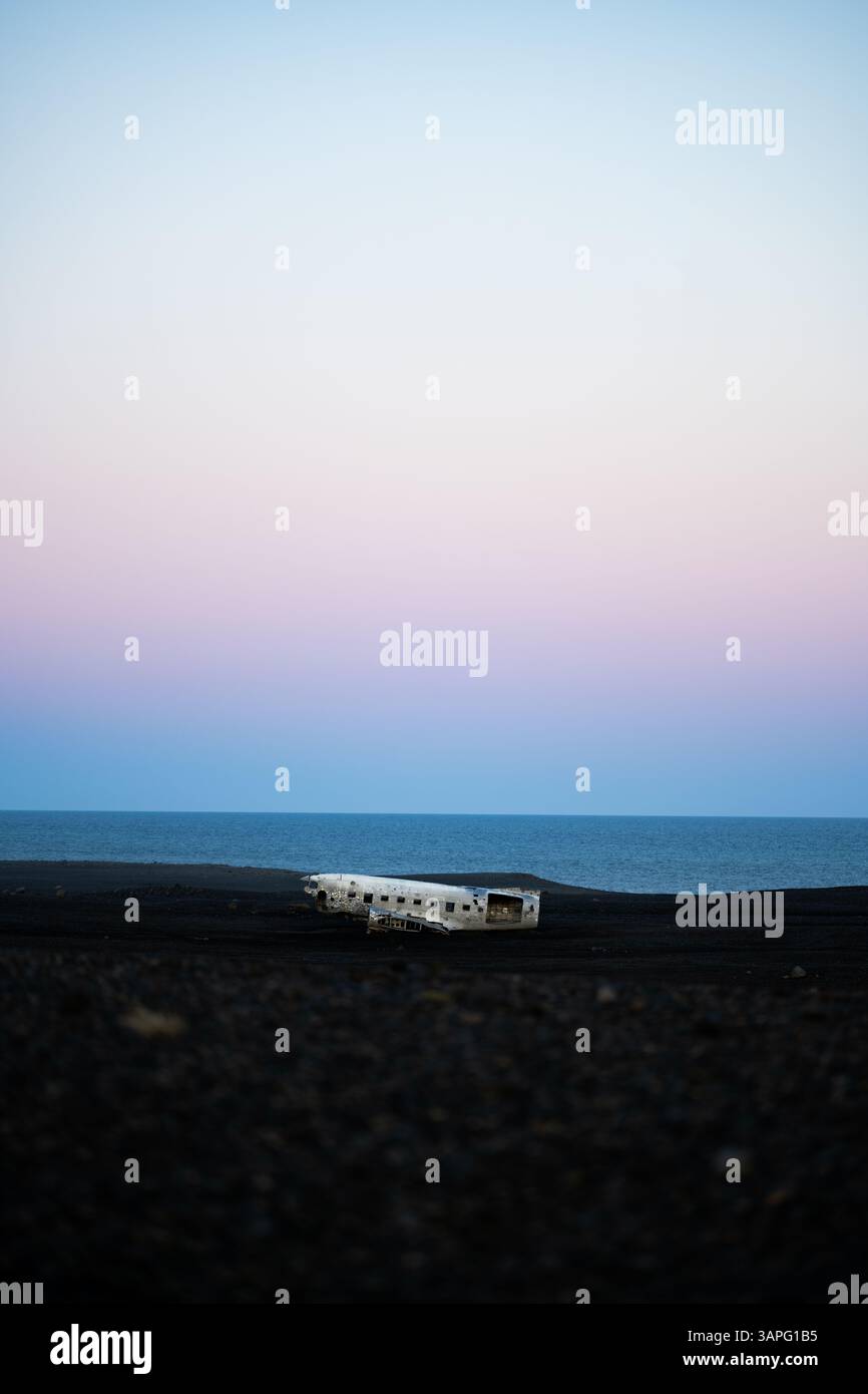 The abandoned US Navy DC-3 plane wreck lies on the black sand beach of ...