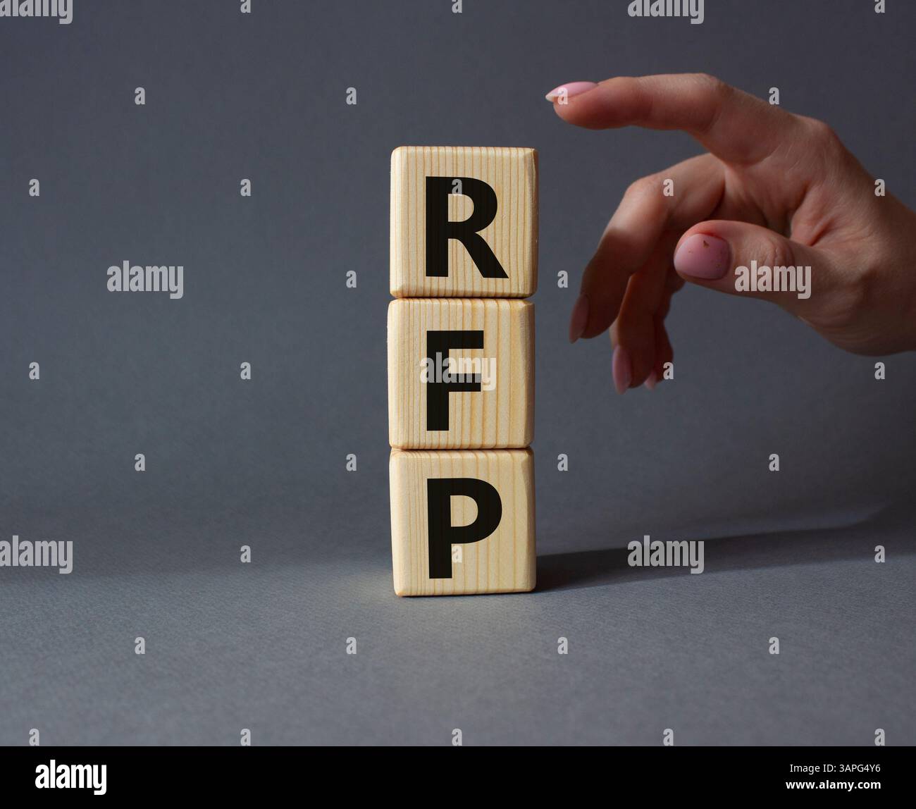 RFP - Request for Proposal. Wooden cubes with word RFP. Businessman ...