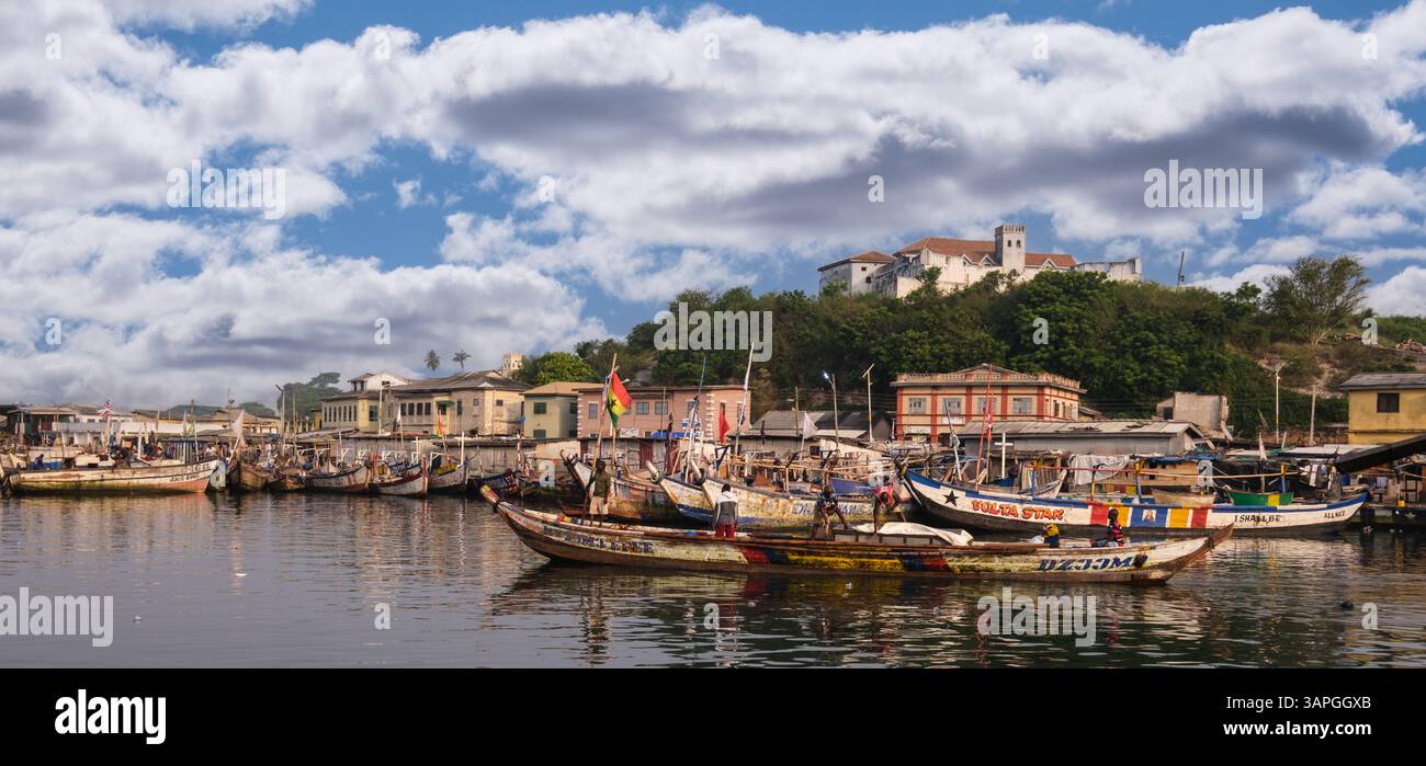 Elmina, Ghana. Old Fishing Boat Harbor. Fort St. Jago on hilltop Stock ...