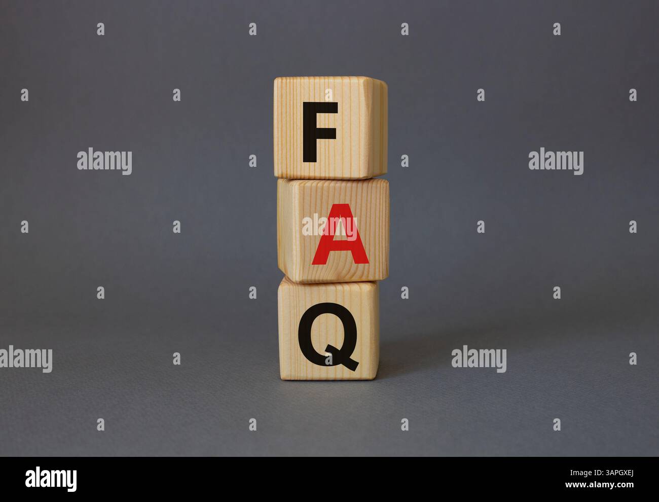 FAQ - Frequently Asked Questions symbol. Concept word FAQ on wooden ...