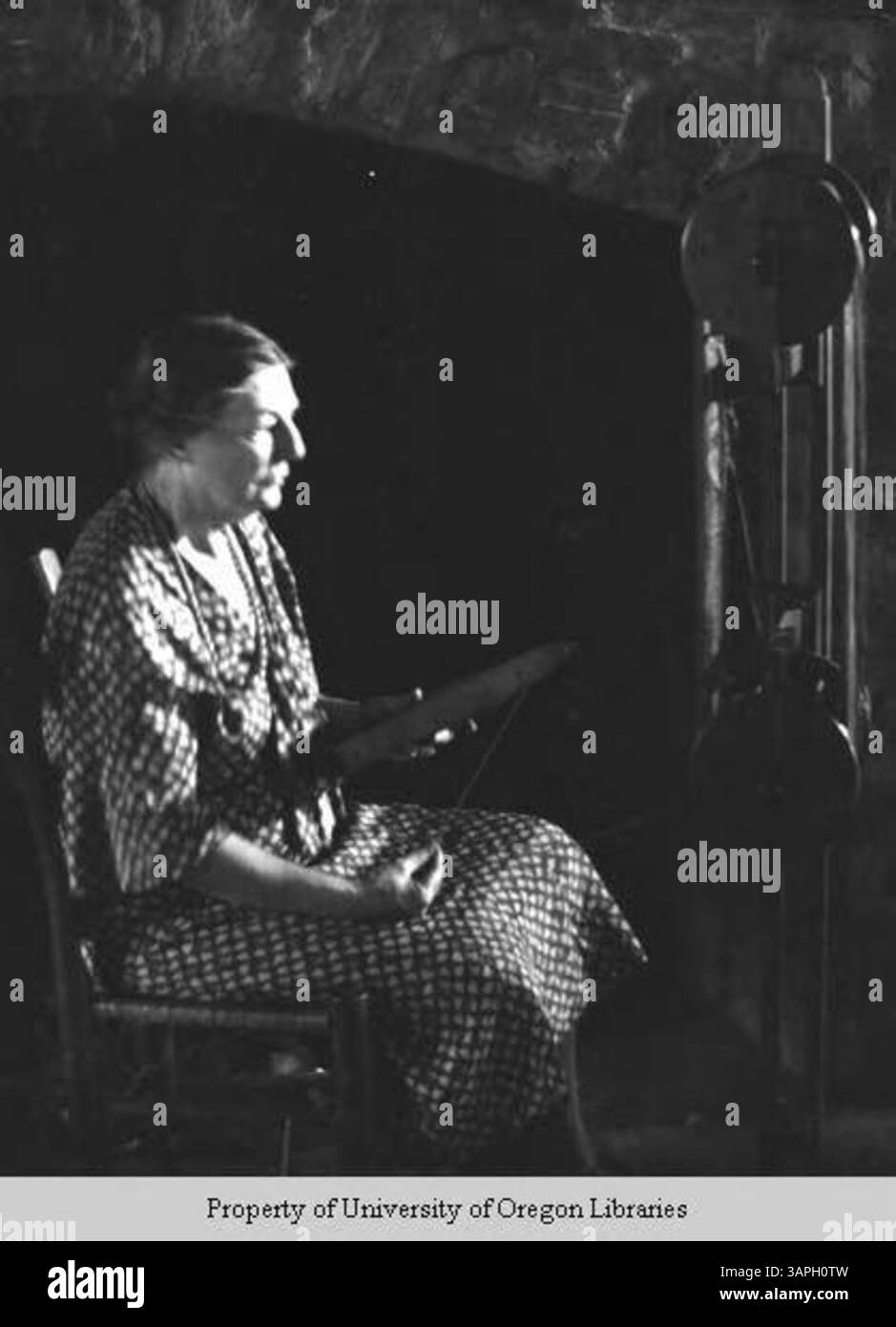 A photograph of Ms. Duffield, a spinner and weaver, captured while ...