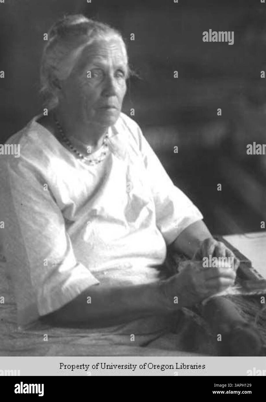 This image depicts Mrs. Mary Anderson, a weaver and spinner from Berea ...