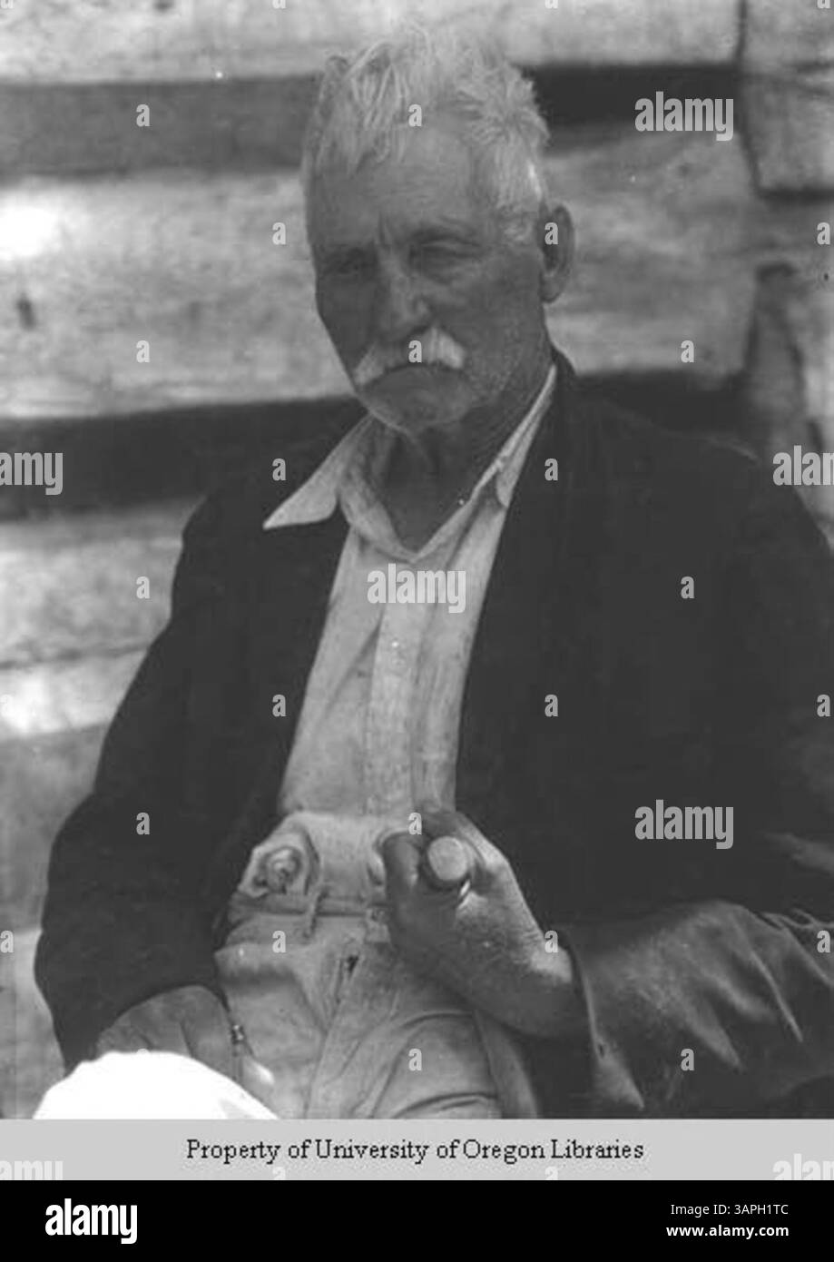 Isaac Davis, a broom maker, is featured in a historical photograph ...