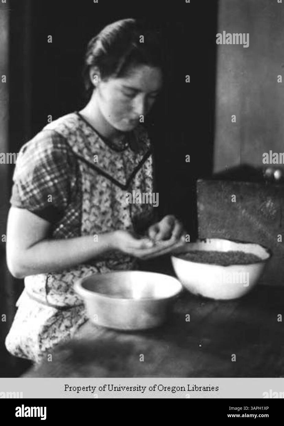 A photograph of a young woman cooking, taken by the University of ...