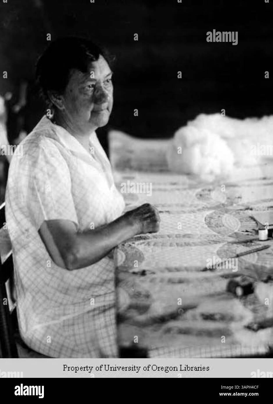 Sarah Alice Hatcher is pictured quilting, demonstrating the traditional ...