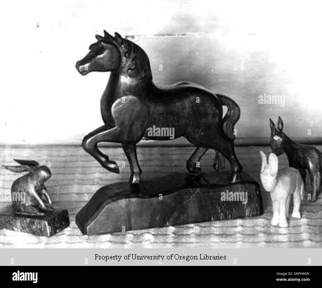 This image features carvings of a horse, donkeys, and a rabbit ...
