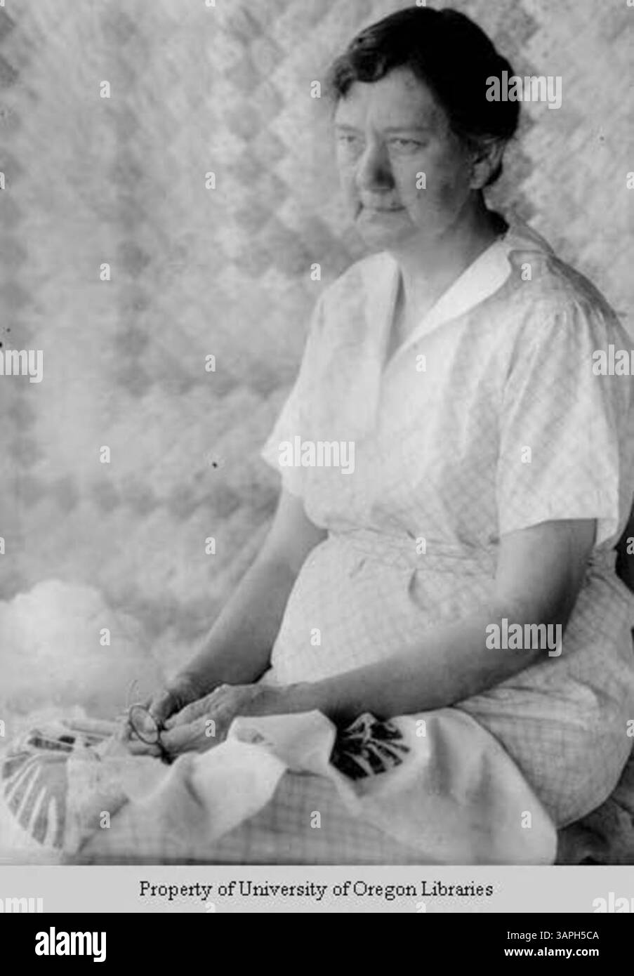 Portrait of Sarah Alice Hatcher, a quilter, with a quilted background ...