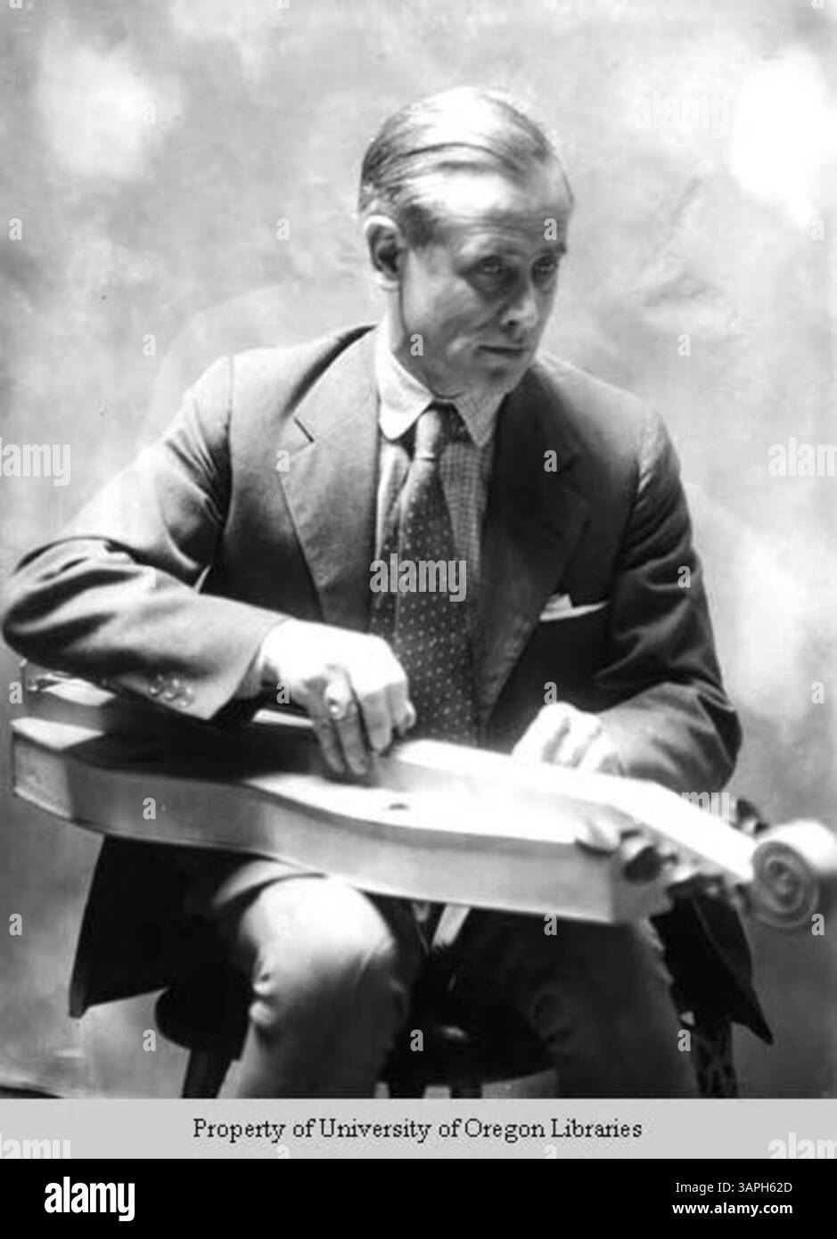 John Jacob Niles is captured playing an Appalachian dulcimer. Known for ...