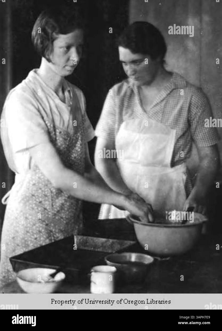 Two women are shown preparing food together, likely in a domestic ...