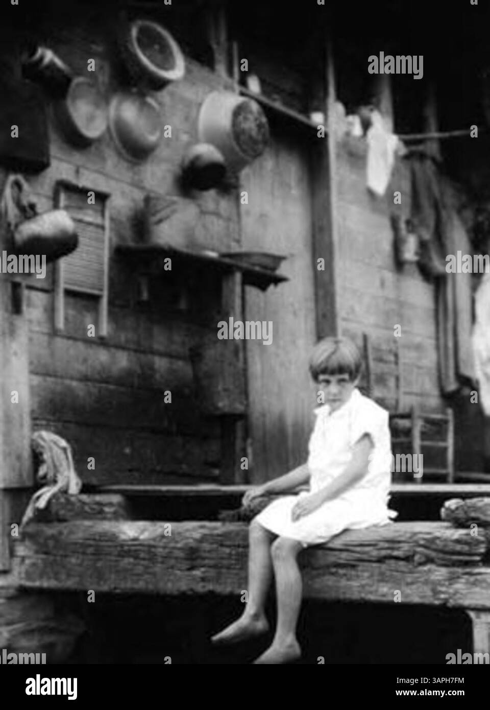 This photograph from the Doris Ulmann collection captures a girl ...