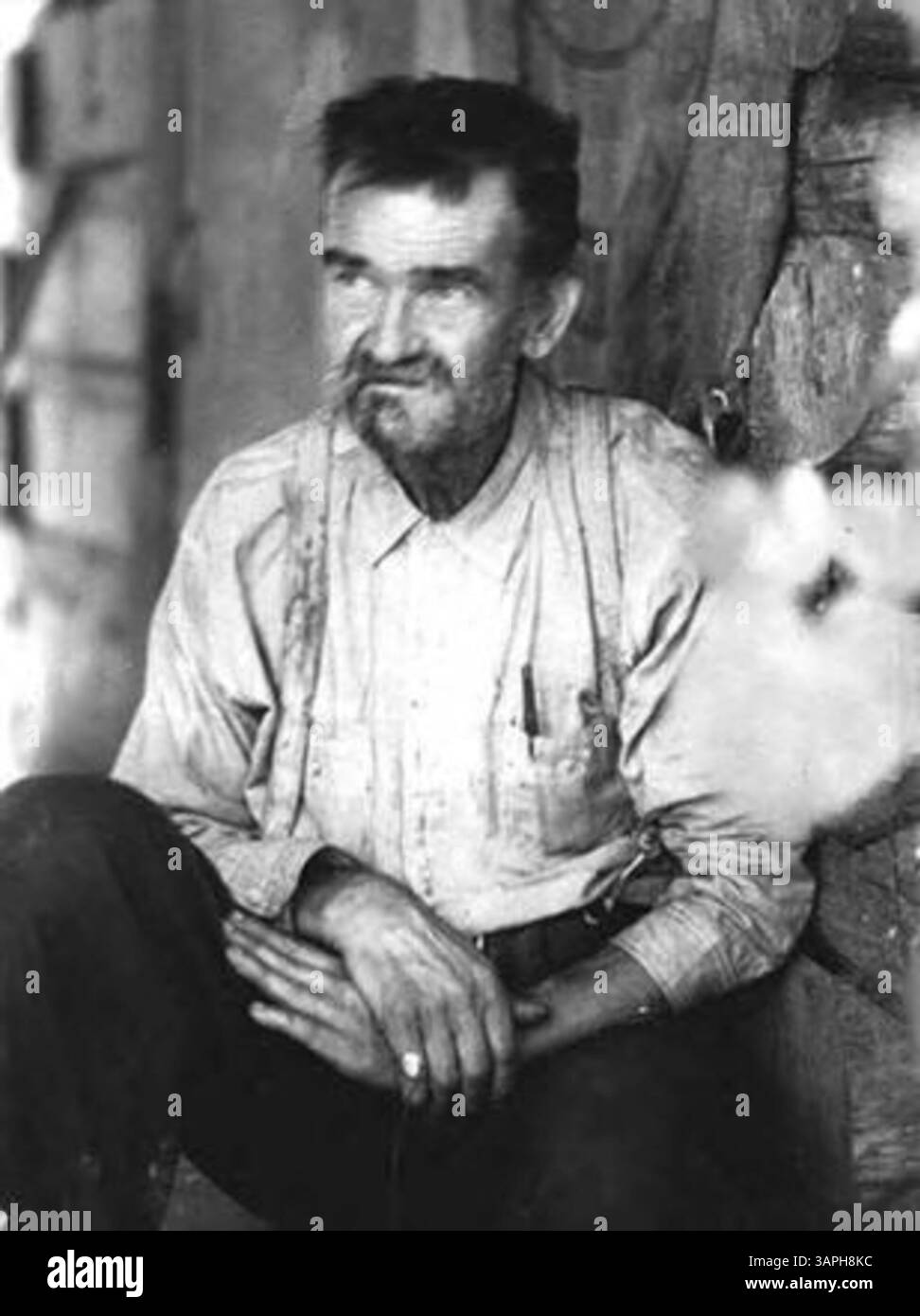 A photograph titled 'Man' from an unknown source, taken before 1931 ...