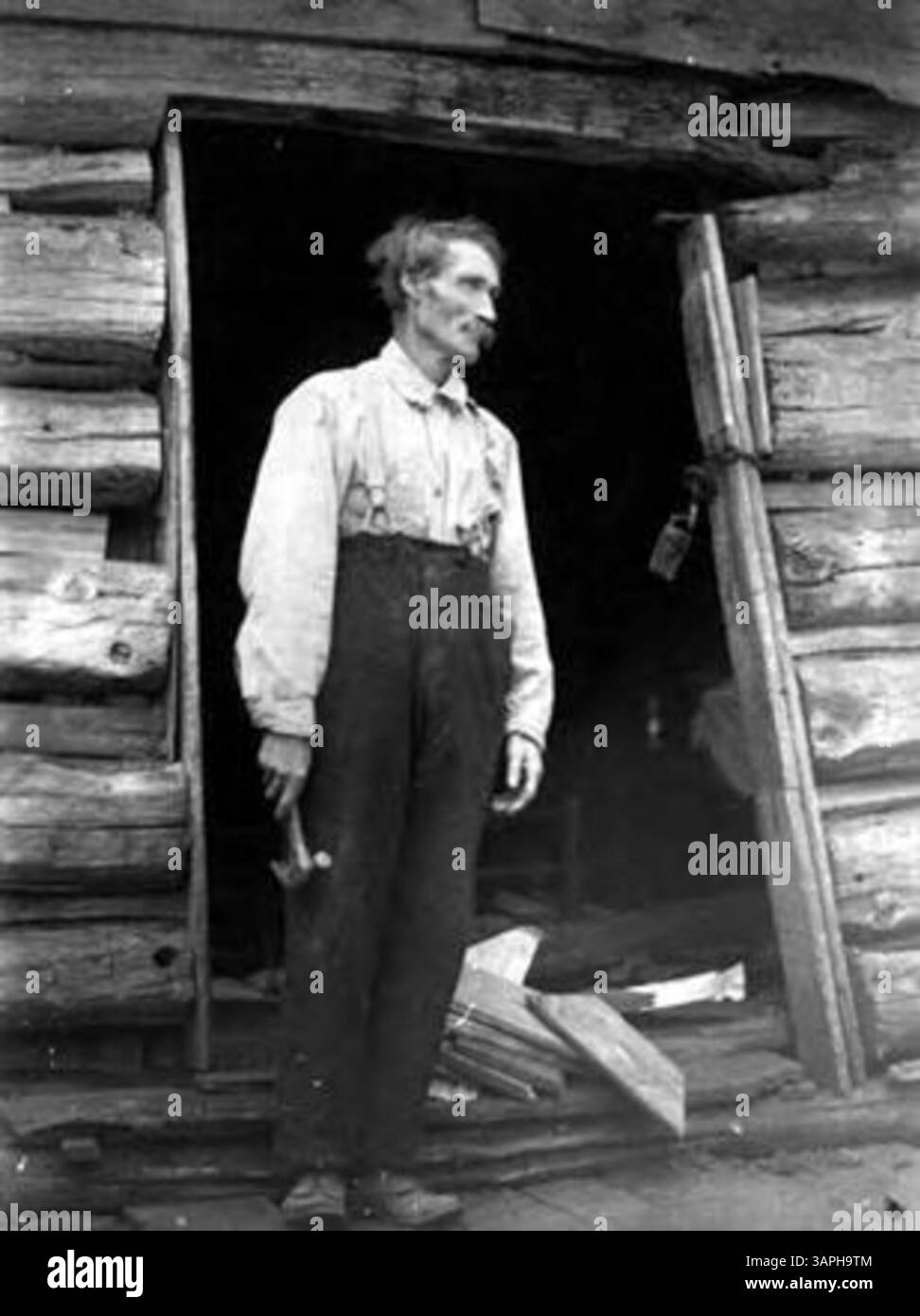 This black-and-white photograph features an unknown man, taken before ...