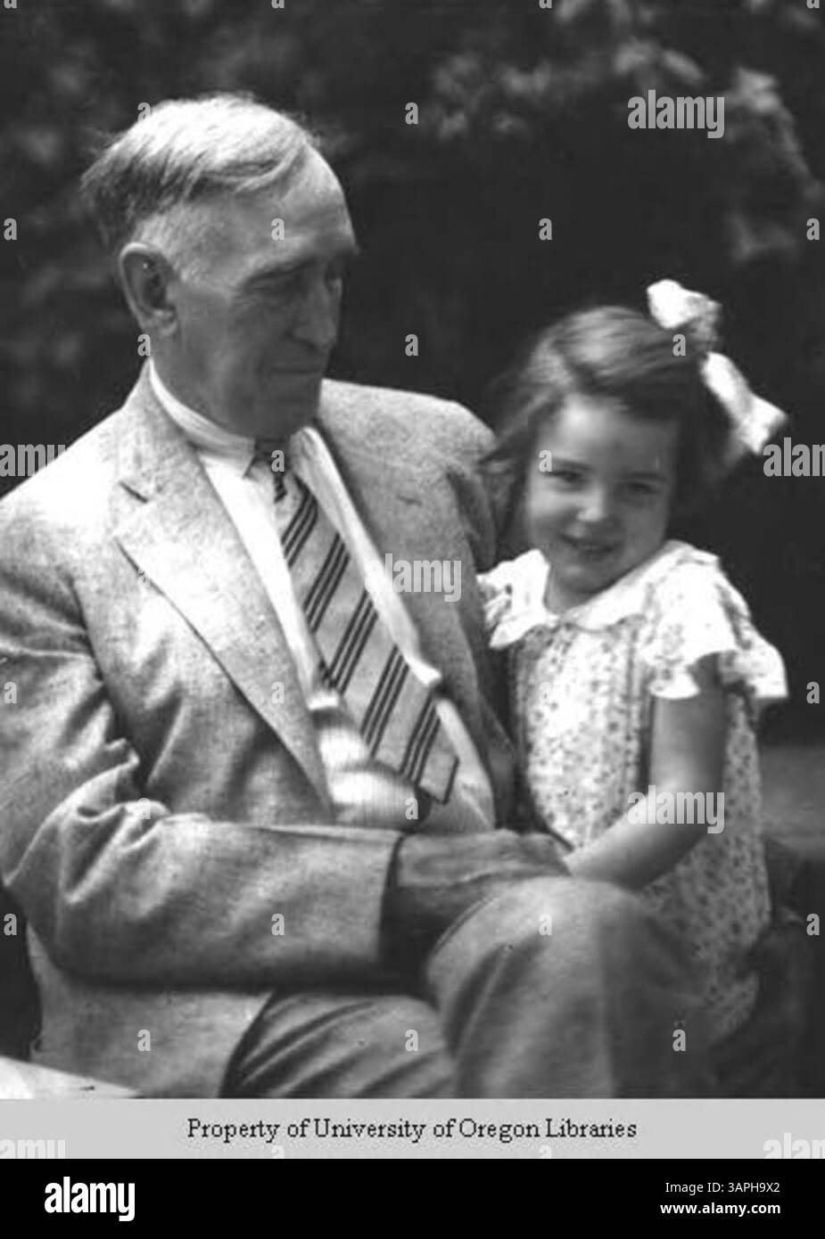 Photograph of Frank Leonard McVey with his granddaughter. The image is ...