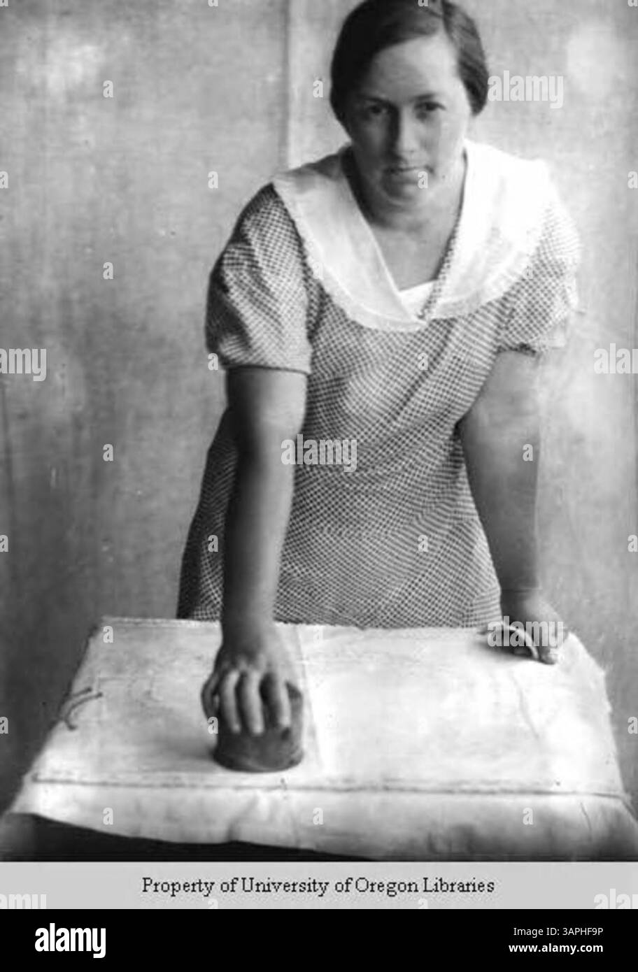 Ethel May Stiles is depicted working with a round wooden block in this ...