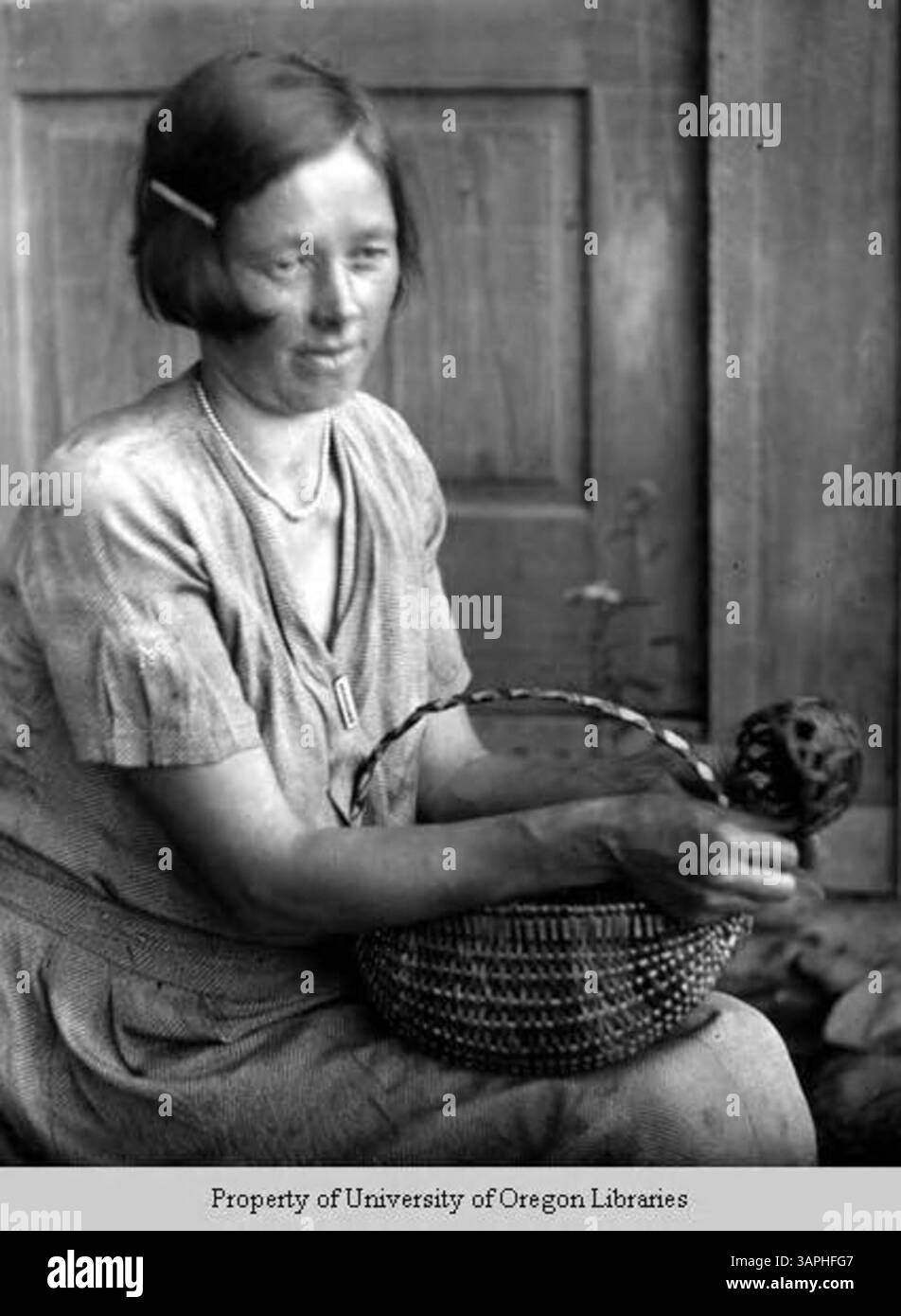 A photograph of Arlene McCarter, a basket and fan maker, captured as ...