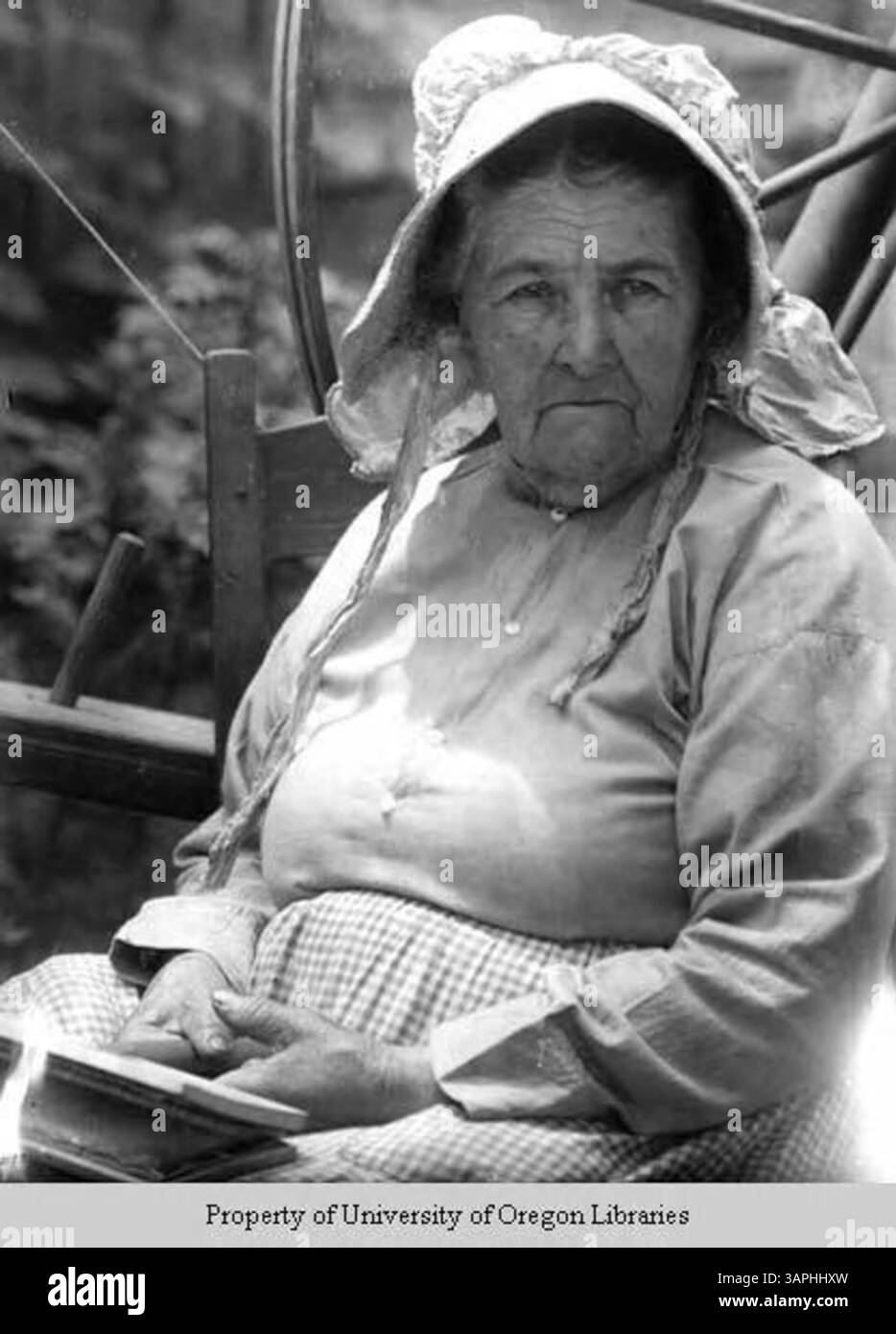 Martha Nichols, a spinner and weaver, is depicted in this image ...