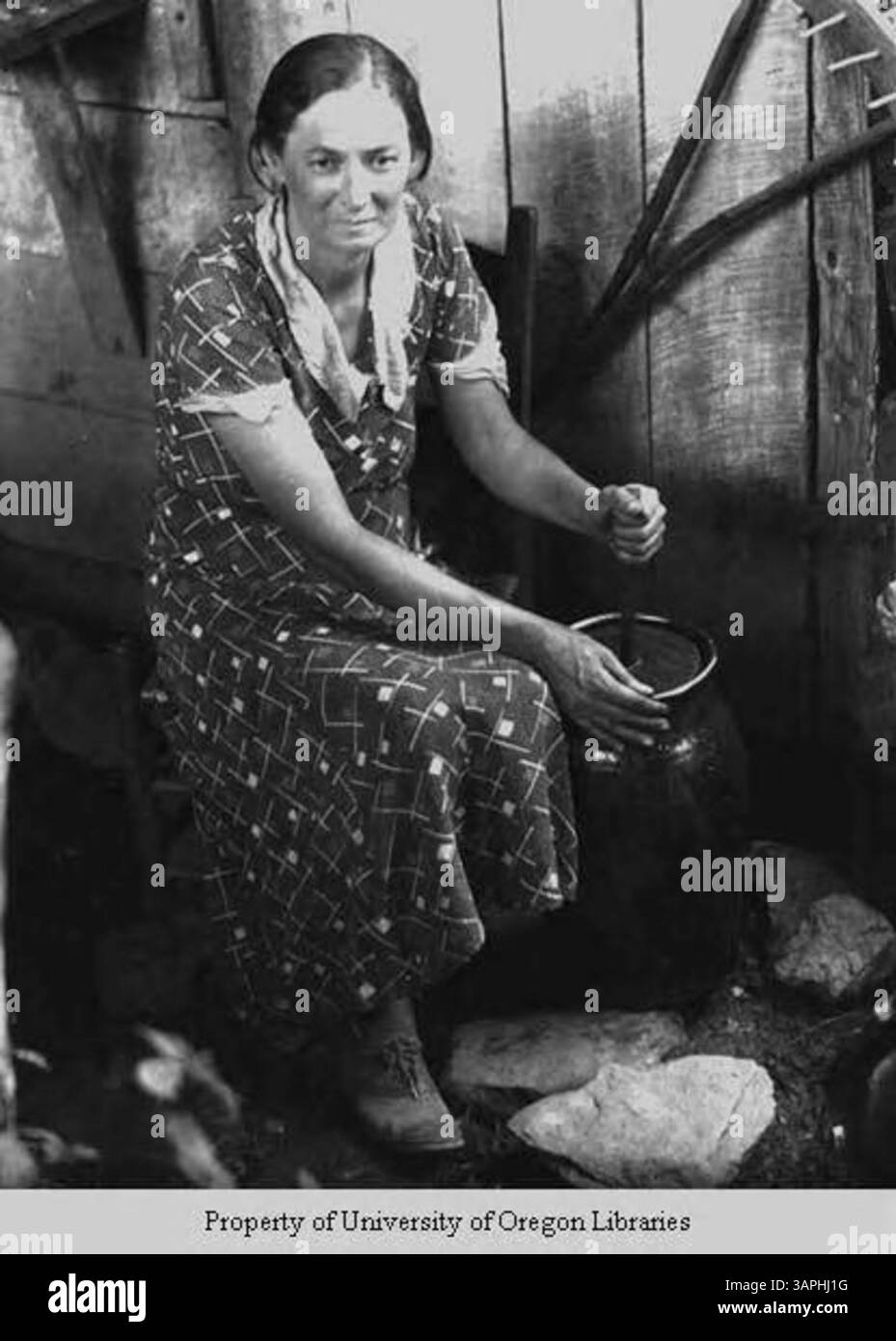 This photograph shows Cora Coker churning, part of the J.C.C.F.S ...
