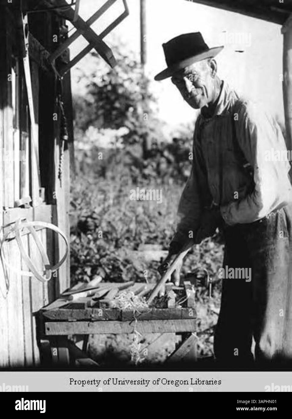 This photograph captures Mac McCarter, a craftsman, making baskets at ...