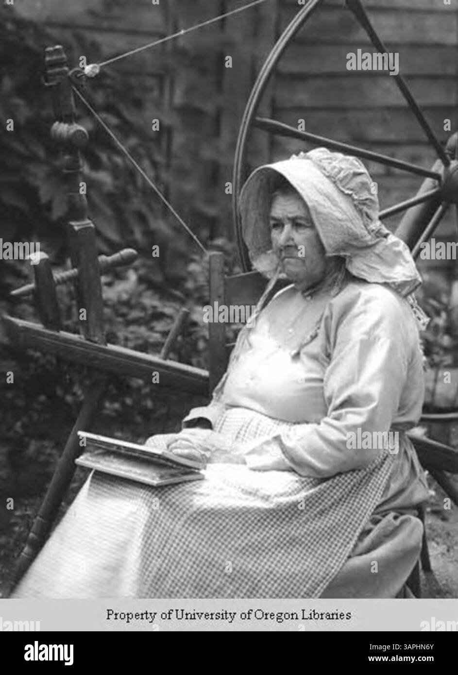 A photograph of Martha Nichols, a spinner and weaver, shown with her ...
