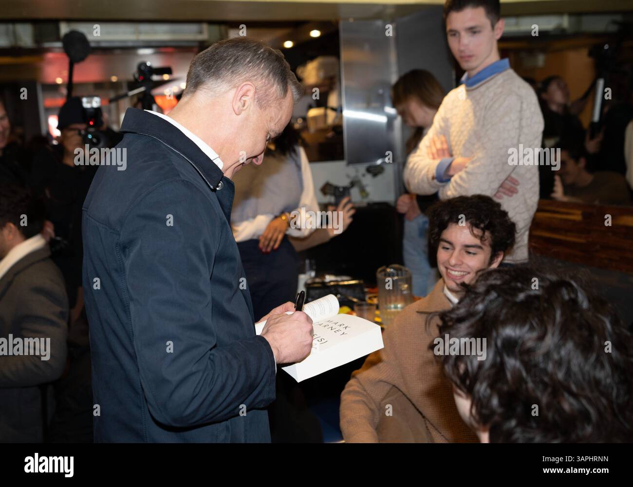 Montreal, Canada. 16th Apr, 2025. Liberal Leader Mark Carney autographs ...