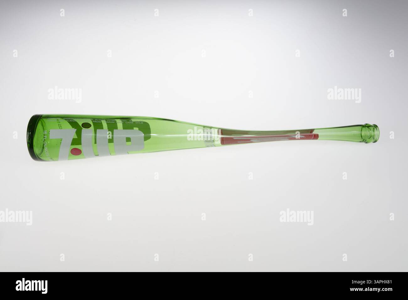 A 16-ounce green glass 7-Up soda bottle that has been stretched. These ...