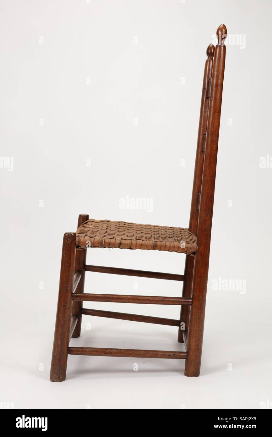 This traditional wooden slat-back side chair features a woven hickory ...
