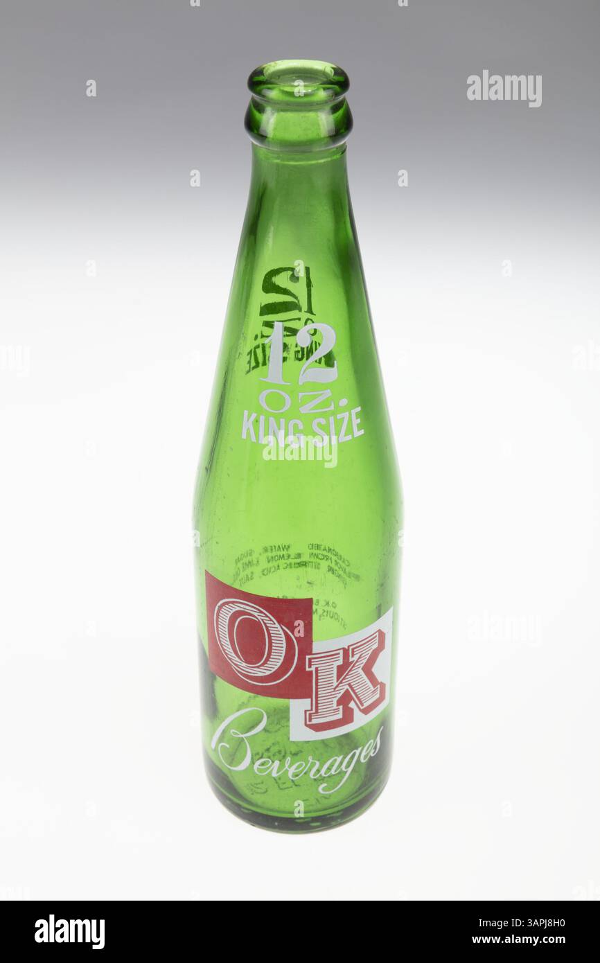The OK Beverage Soda Bottle is a clear green glass bottle from the OK ...