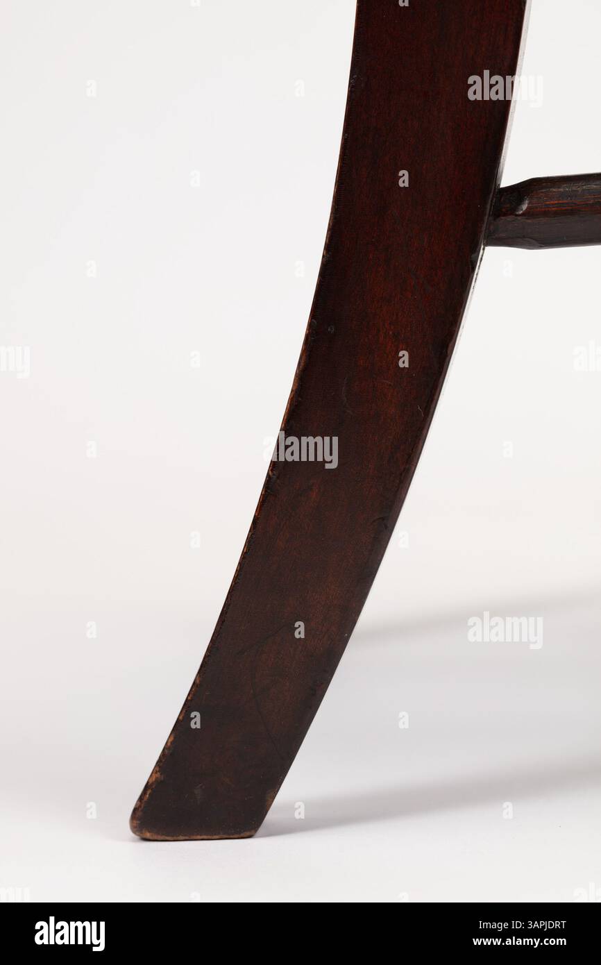 A mahogany Klismos chair with a fiddle-shaped back splat and a blue ...