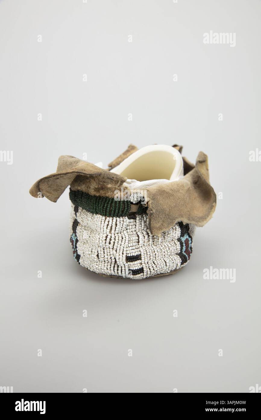 These moccasins, decorated with Cheyenne beadwork, are examples of ...