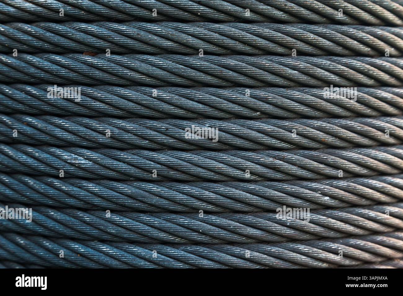 Steel twisted cable wound on a drum, next to each other, close-up Stock ...