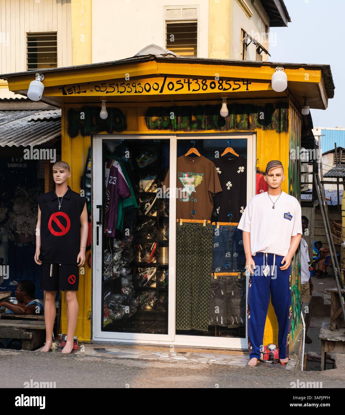 Ghana, Elmina. Men's Sports Clothing Store Stock Photo - Alamy