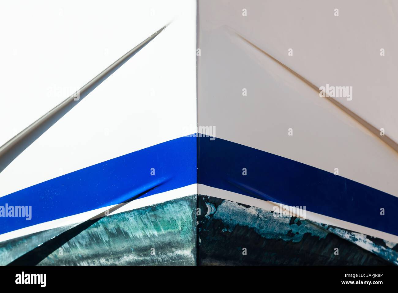 The bow of the yacht, bottom view, close-up. The waterline is clearly ...