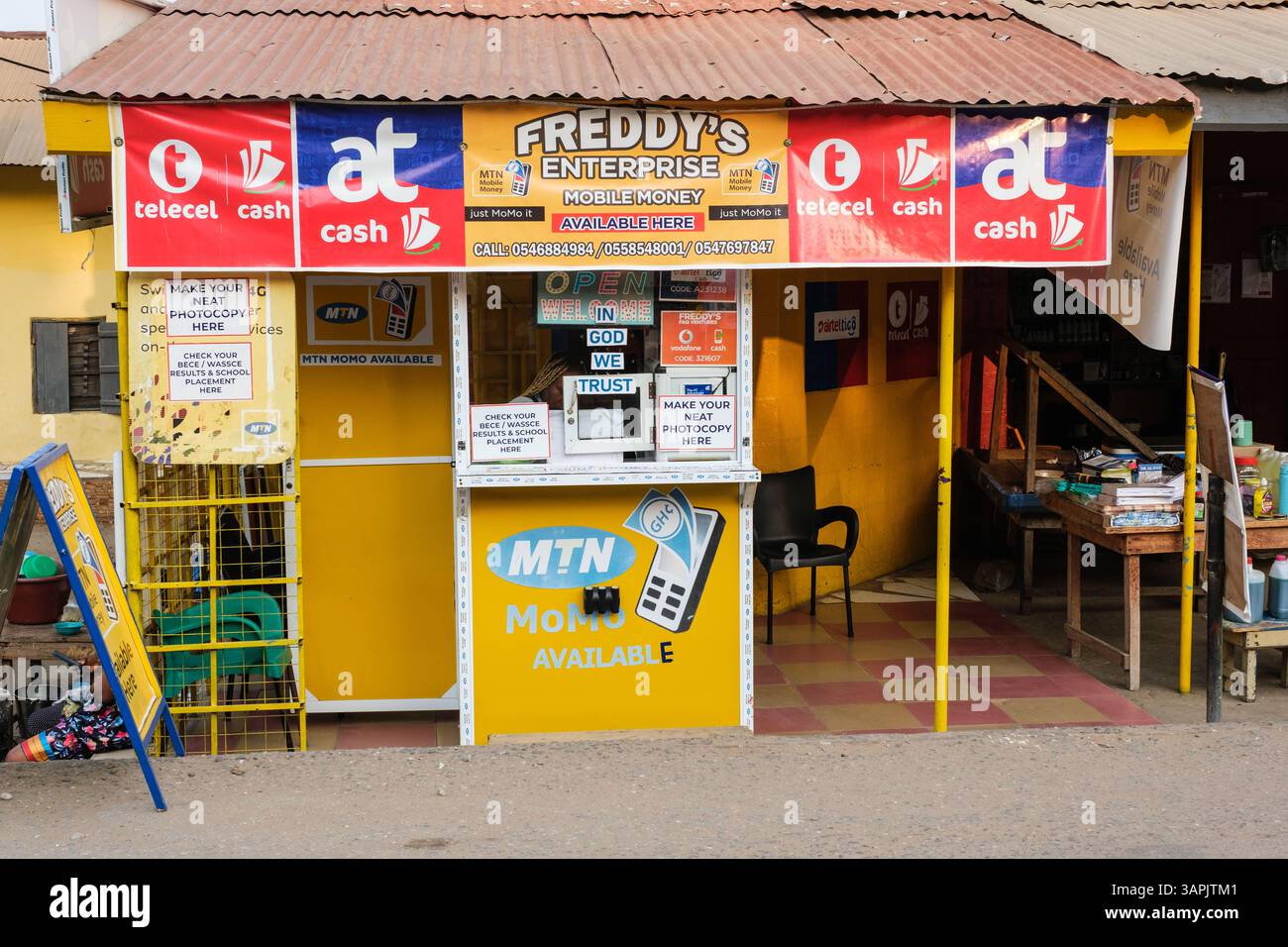 Ghana, Elmina. Mobile Money Shop Offering Other Services Stock Photo ...