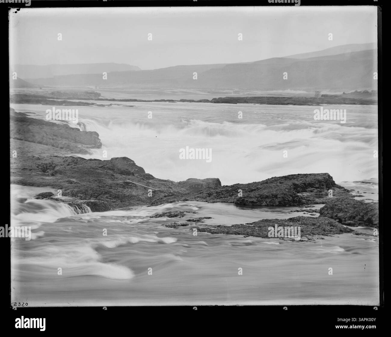 The photograph depicts the Dalles of the Columbia River, including ...