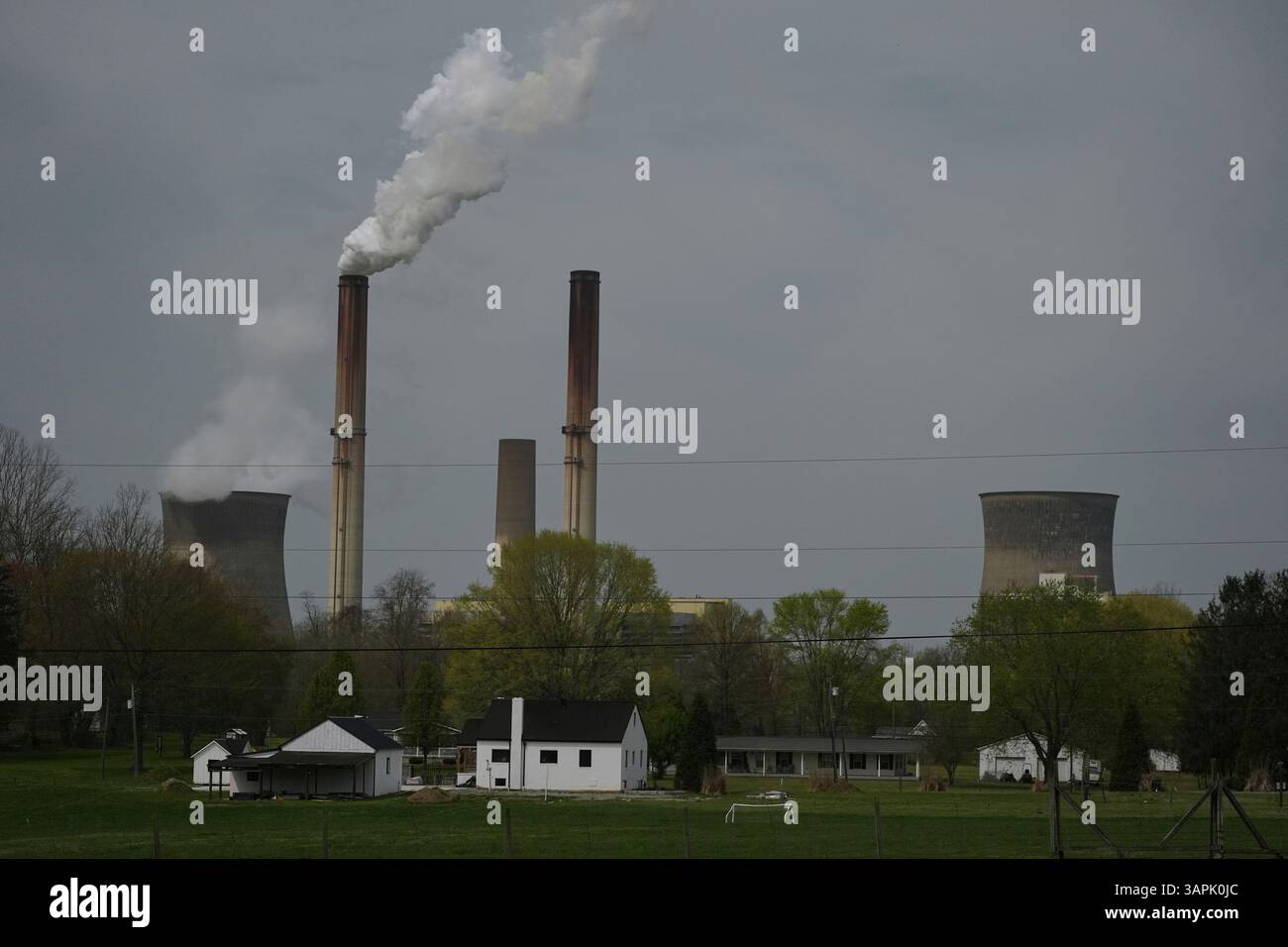 A home stands near the Gen. James Gavin Power Plant, a coal-fired power ...