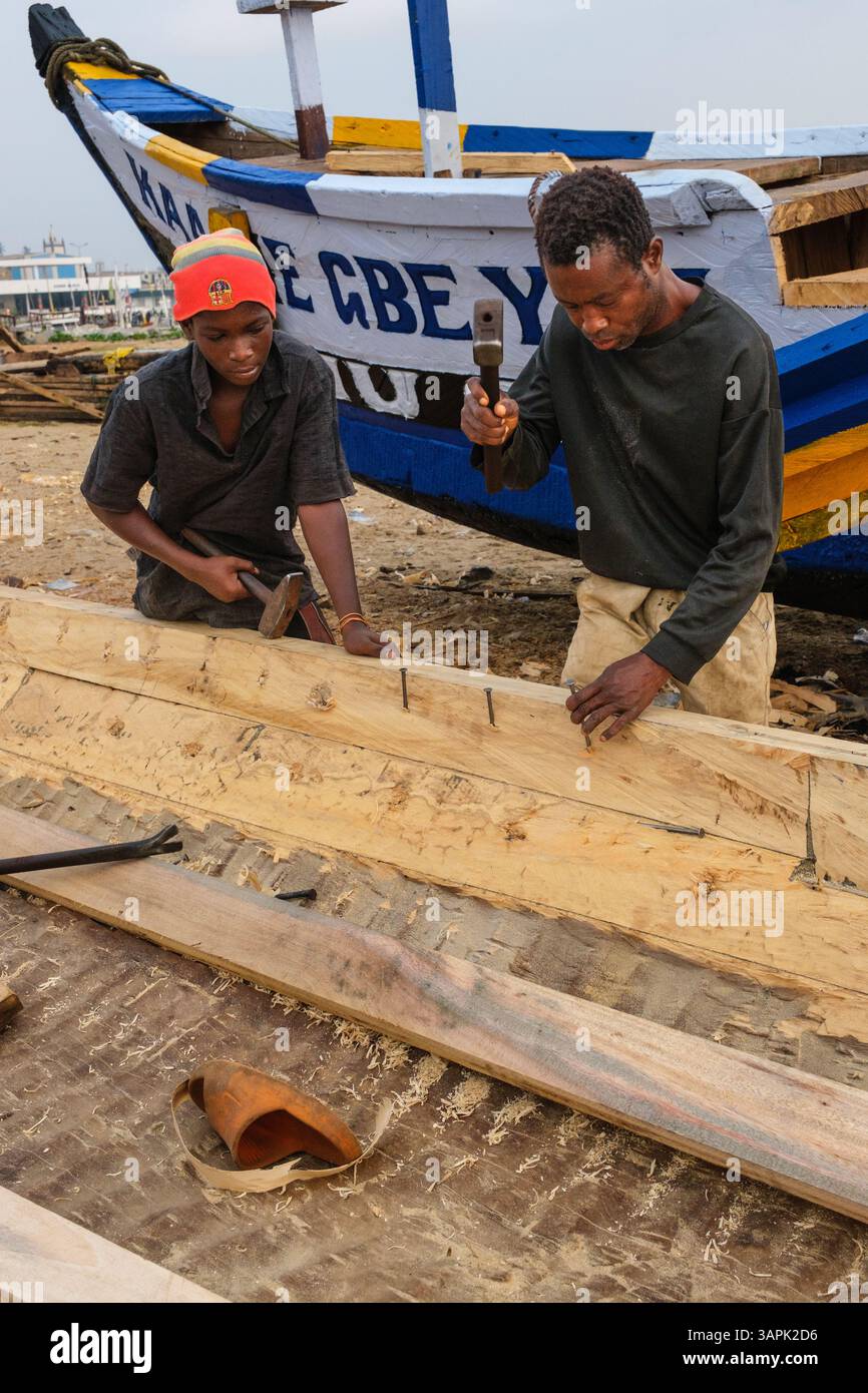 Ghana, Elmina. Carpenters at Work Building a New Fishing Boat. A boat ...