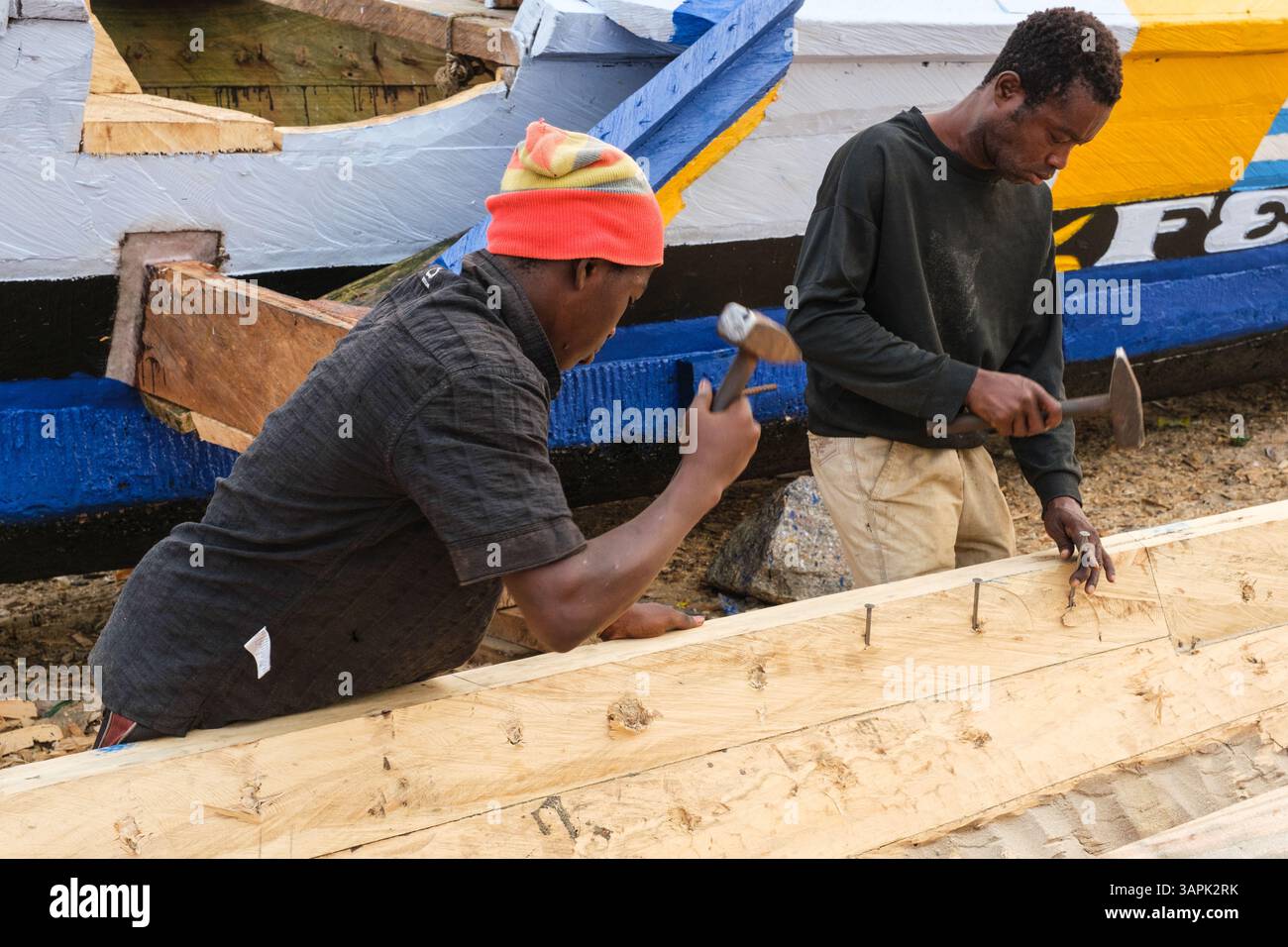 Ghana, Elmina. Carpenters at Work Building a New Fishing Boat. A boat ...