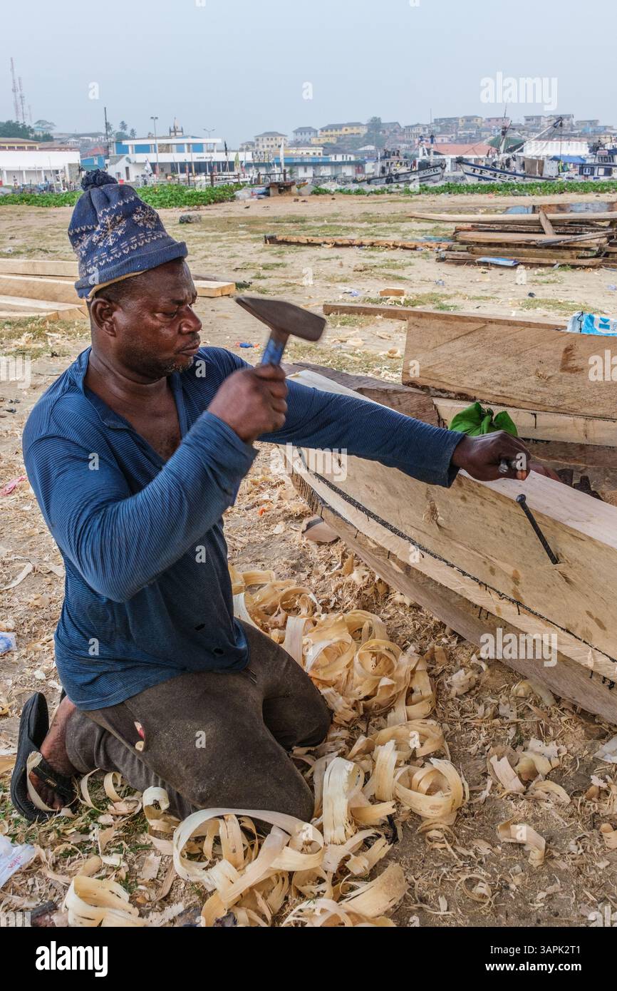 Ghana, Elmina. Foreman of a Carpenter Crew Building a New Fishing Boat ...